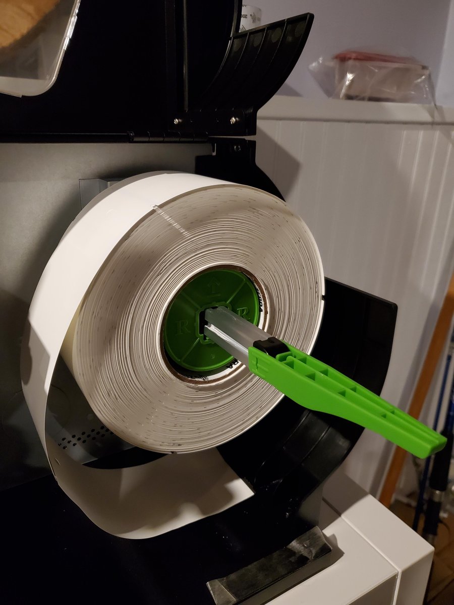 How do I install and calibrate branded paper into my industrial printer?